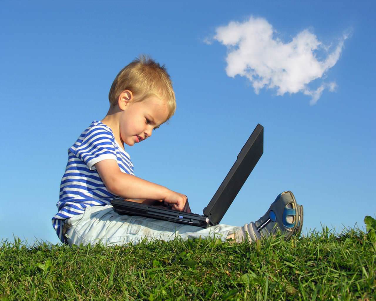 Kid Typing on Computer - Ramsey Voice Studio
